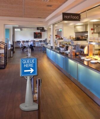 Queue Here Sign - Signs2Schools